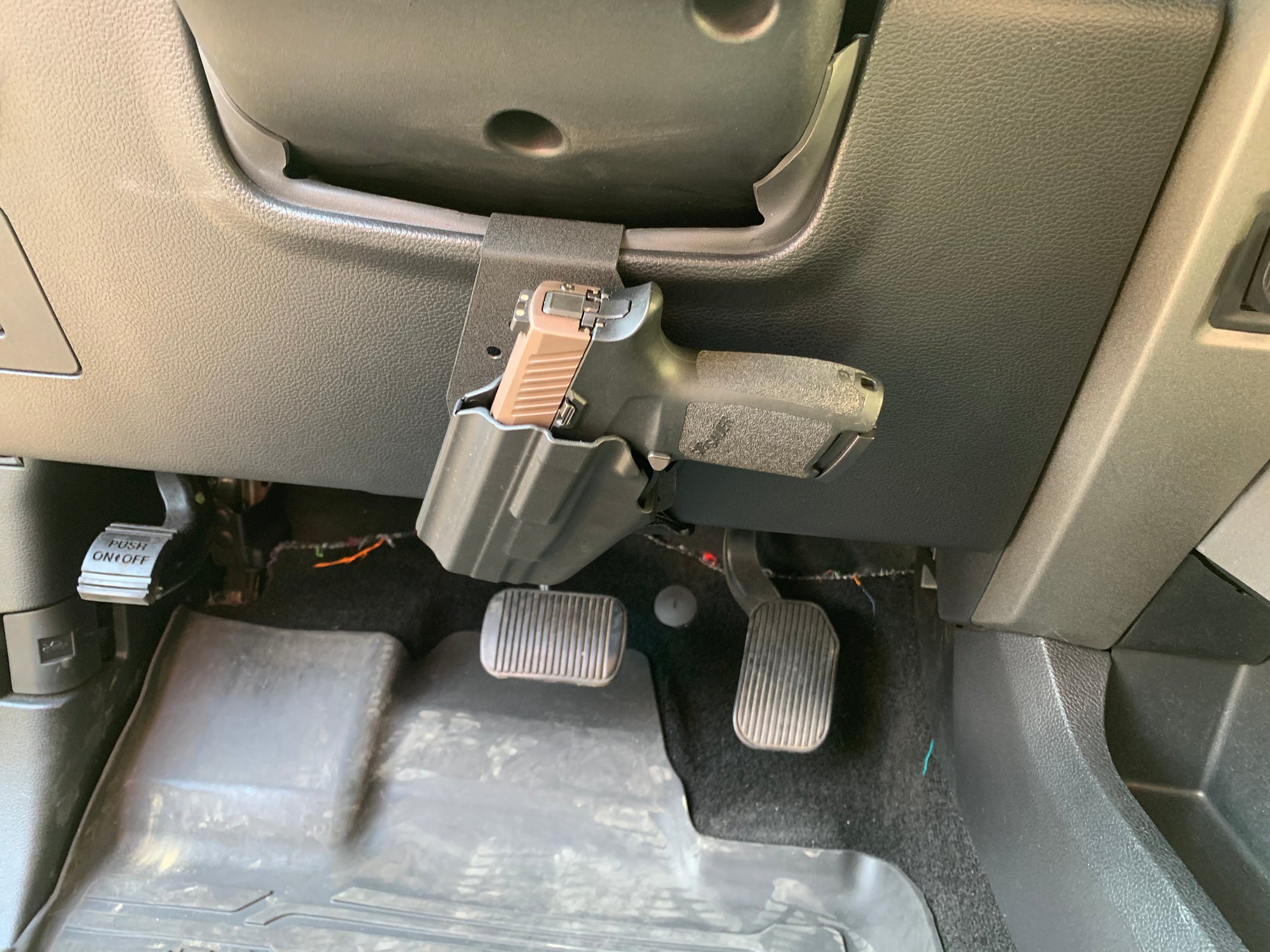 Universal under steering column pistol carrier - GunMount